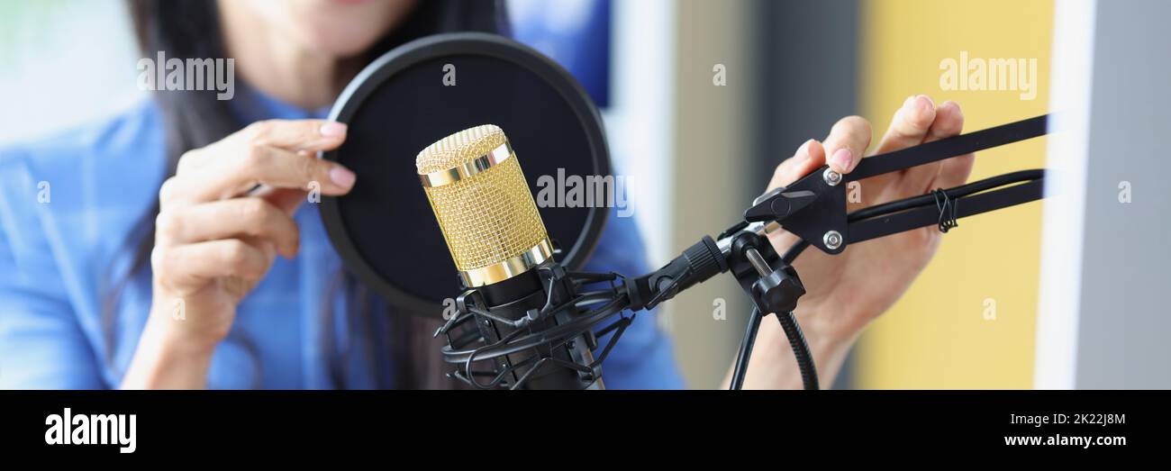 Radio presenter works adjusts microphone, prepares speak before ...