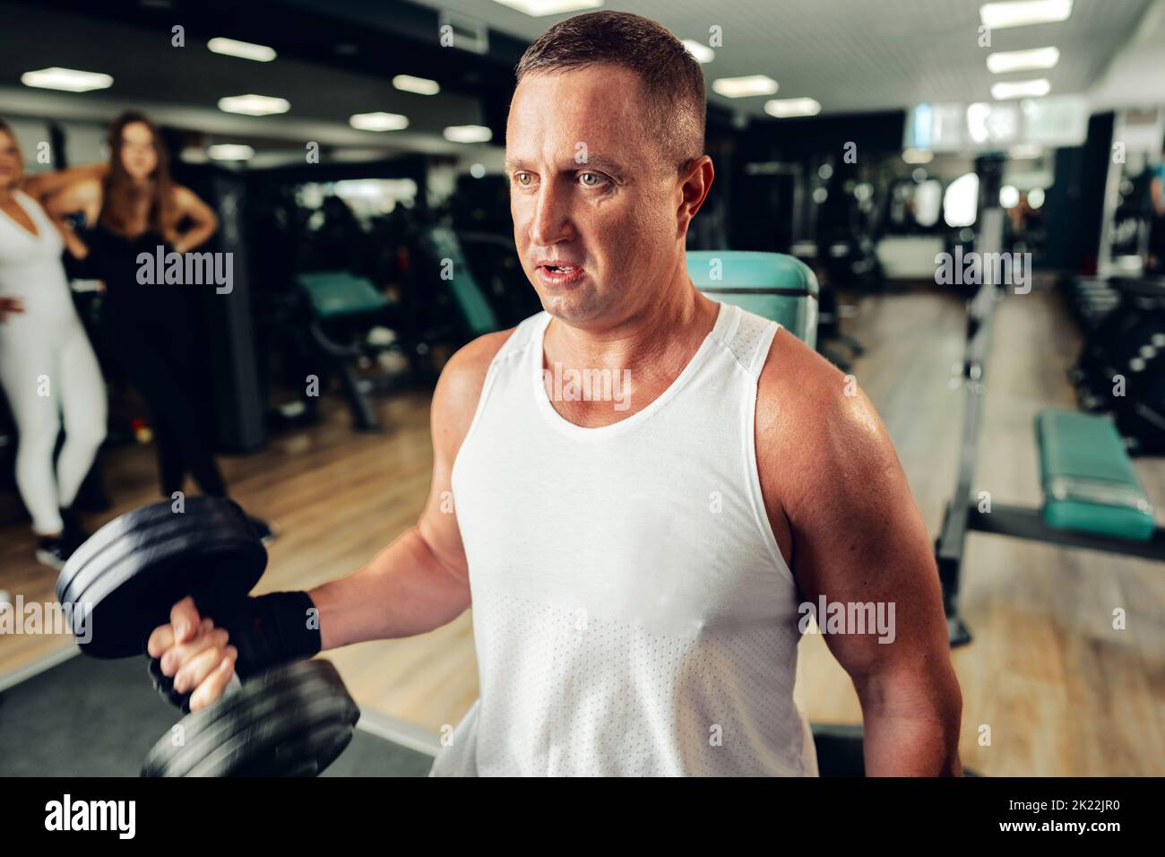 Middle-aged fit muscular man training in a sports gym Stock Photo - Alamy