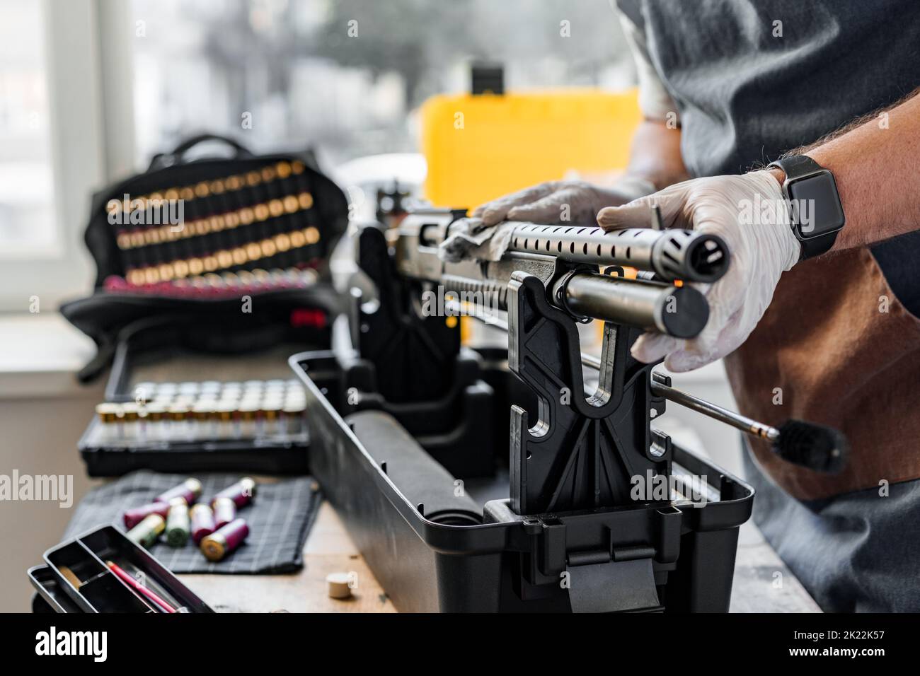 The gunsmith maintaining his rifle in a workshop Stock Photo - Alamy