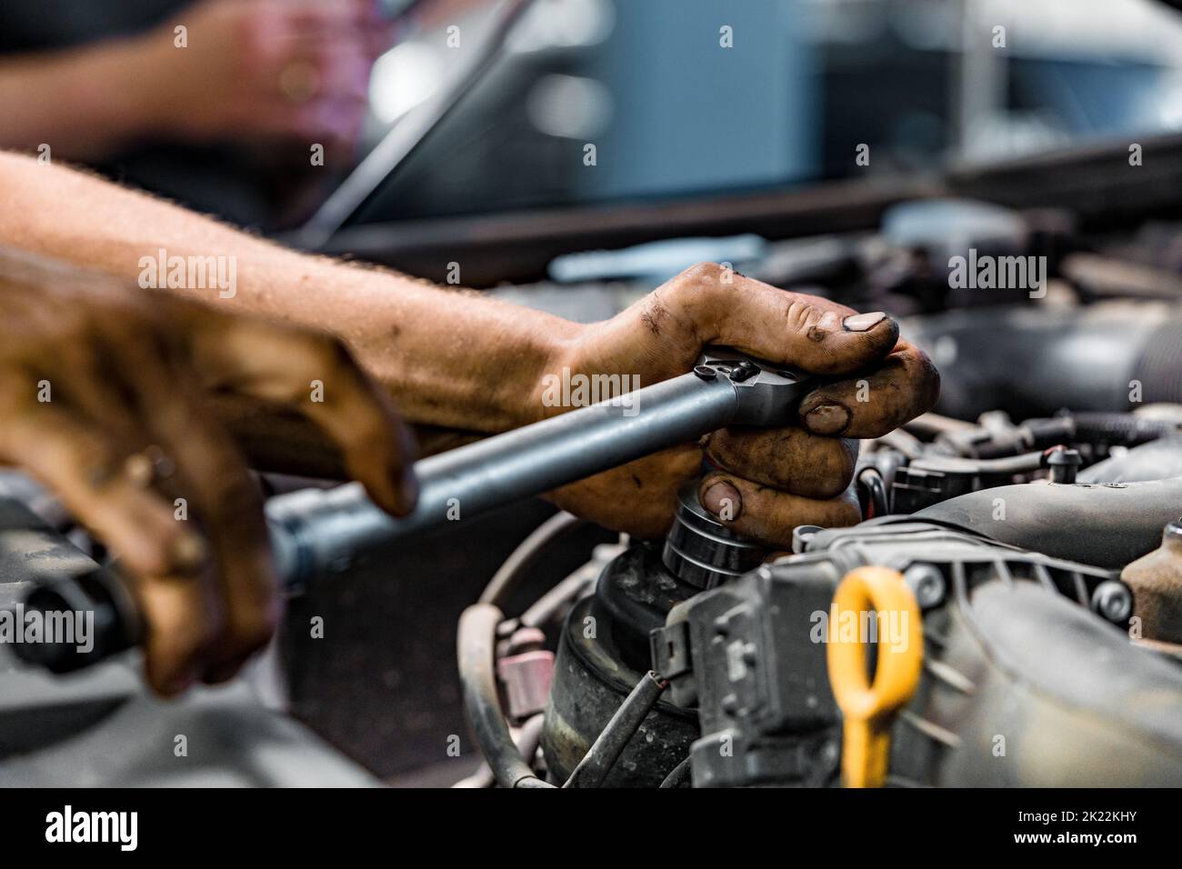 Close up of auto mechanic repairing car engine in car service Stock ...