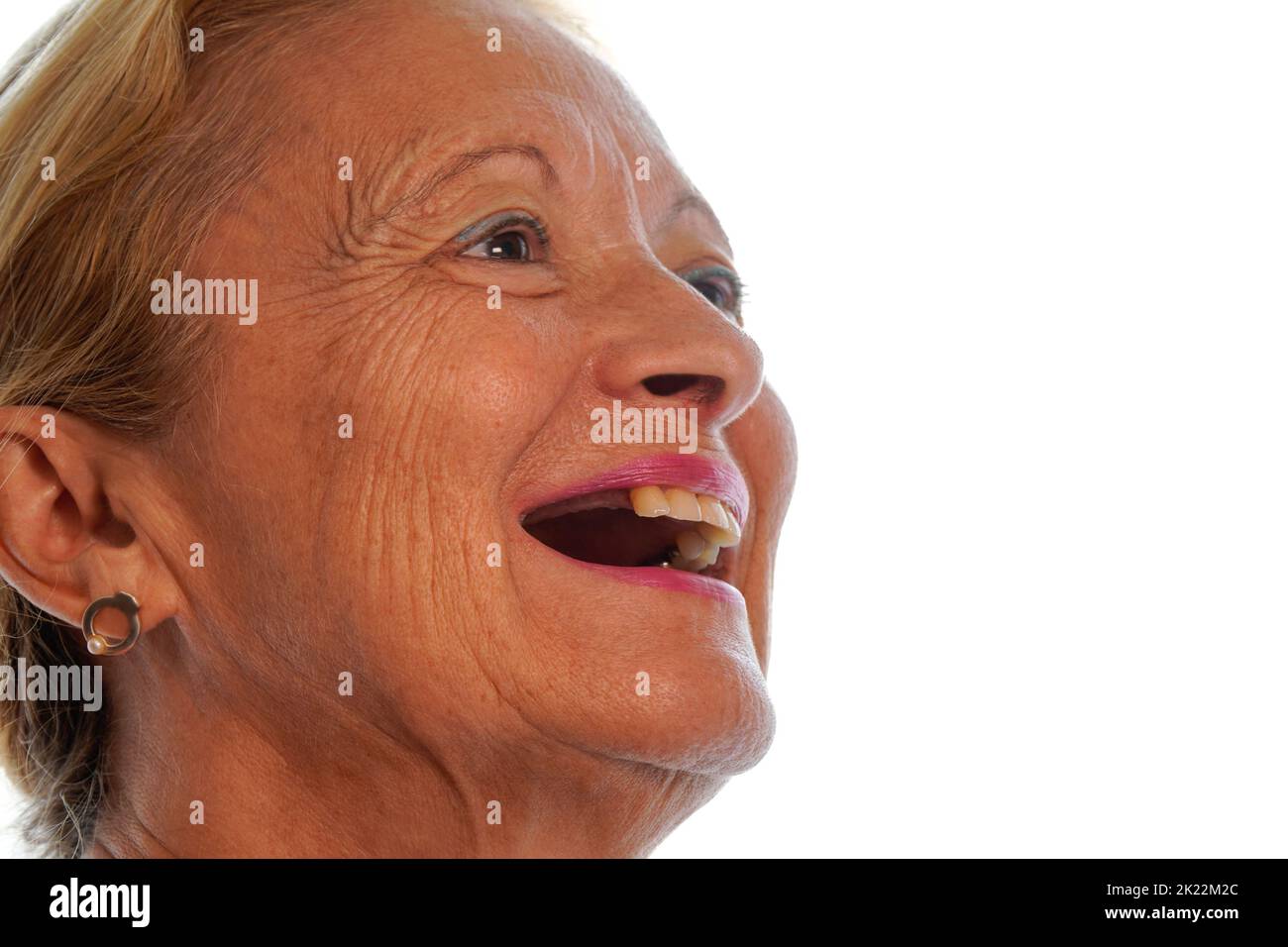 portrait of elderly woman in profile showing that she has missing teeth ...