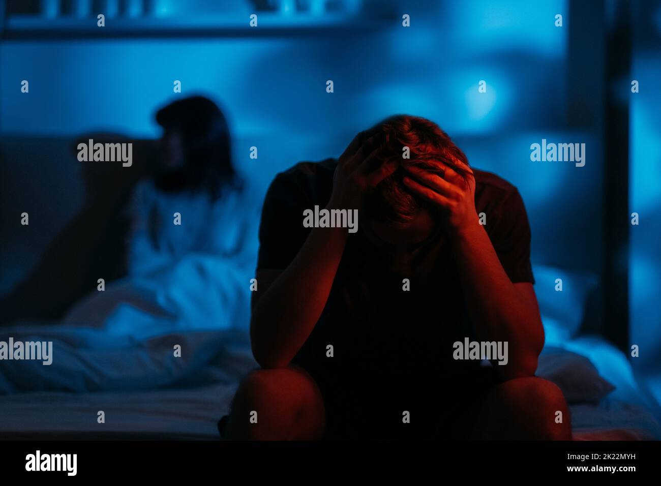 Couple quarrel. Night conflict. Divorce issue. Depressed devastated man ...