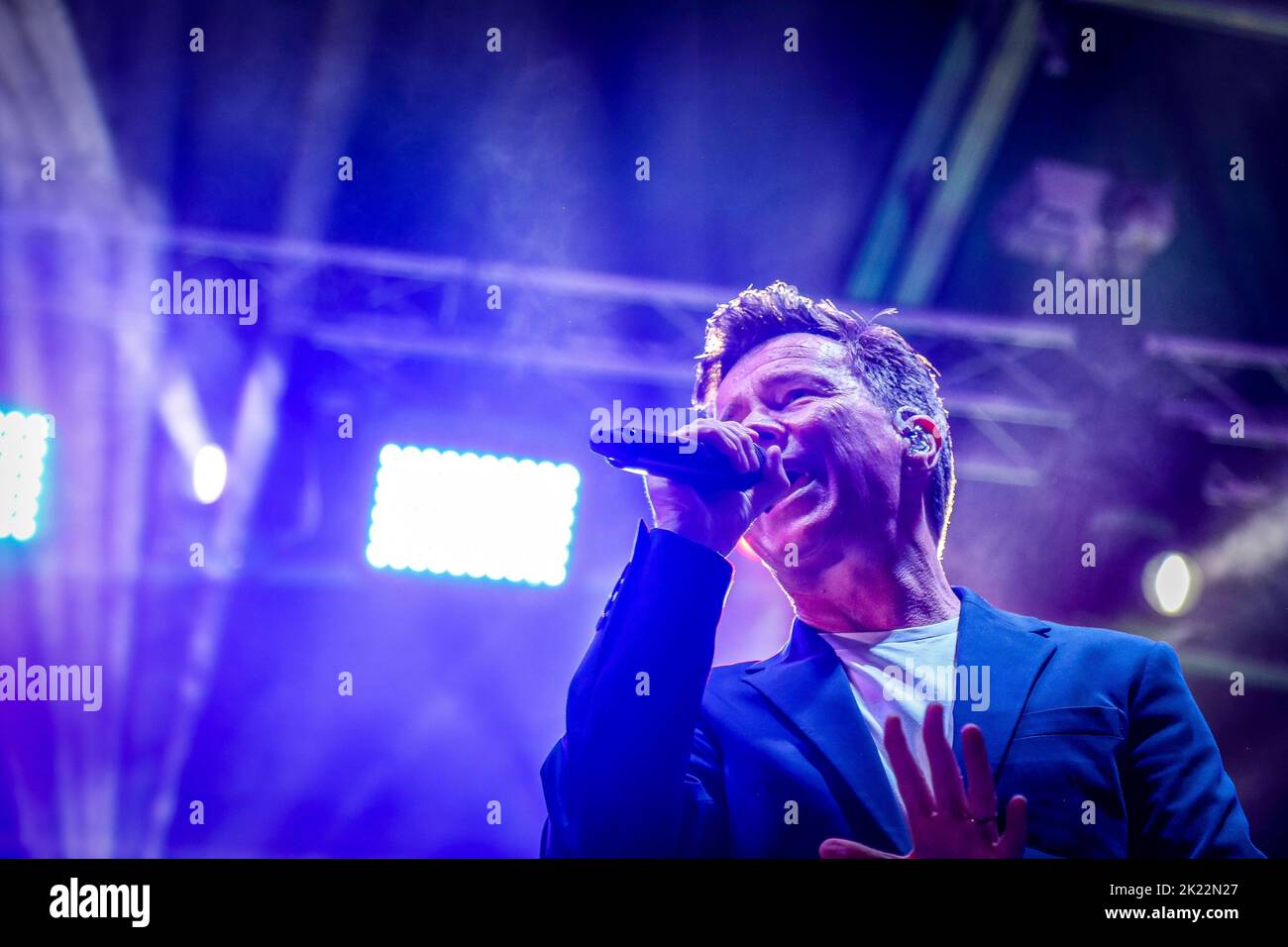 A low-angle shot of the singer Richard Paul Astley performing at the ...