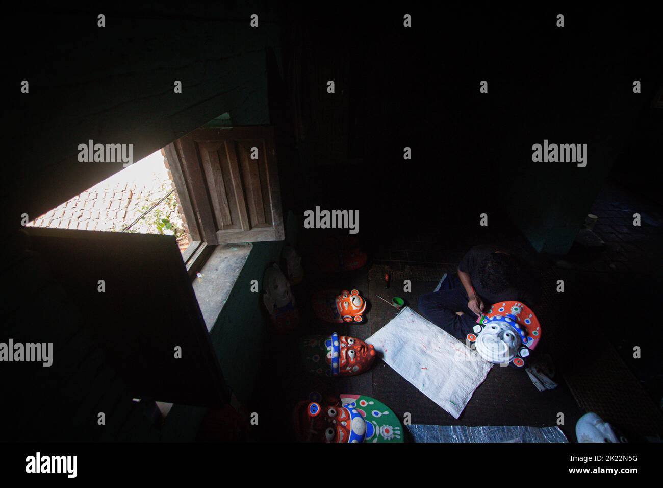 Nepal. 22nd Sep, 2022. Chitrakar's family giving the final touch in a mask of the 13 deities for ...
