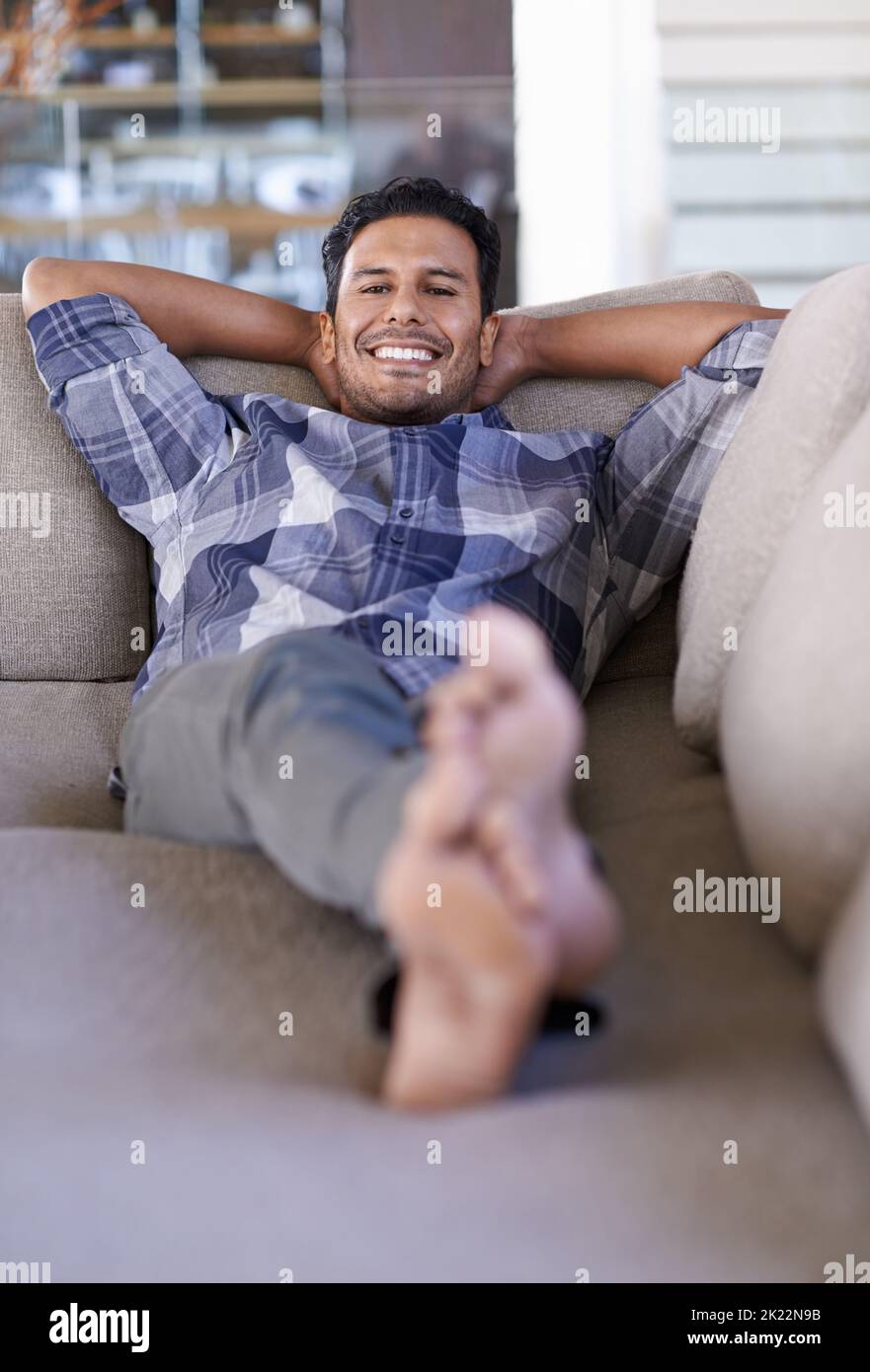 Feels like a first class seat to me. a young man relaxing indoors on ...