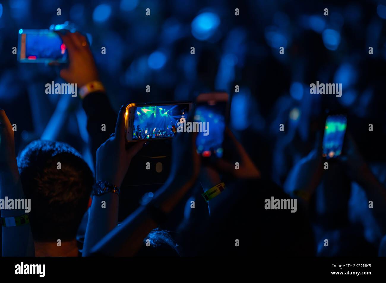 Hands with phones on concert, atmosphere on concert, stage lights Stock ...