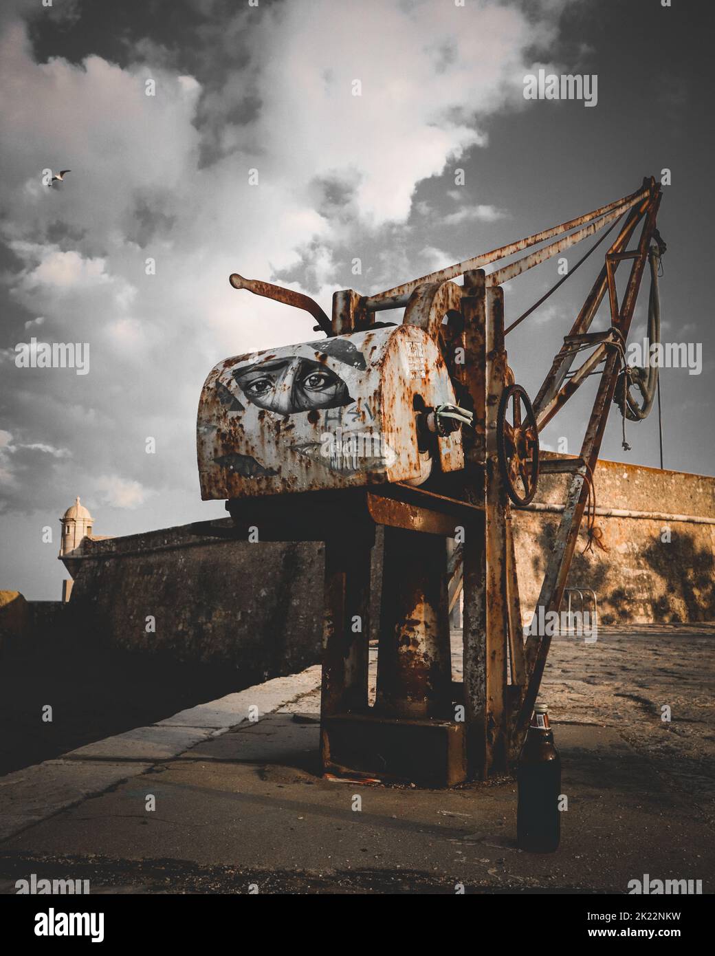A vertical shot of graffiti on old big rusty industrial machine Stock ...