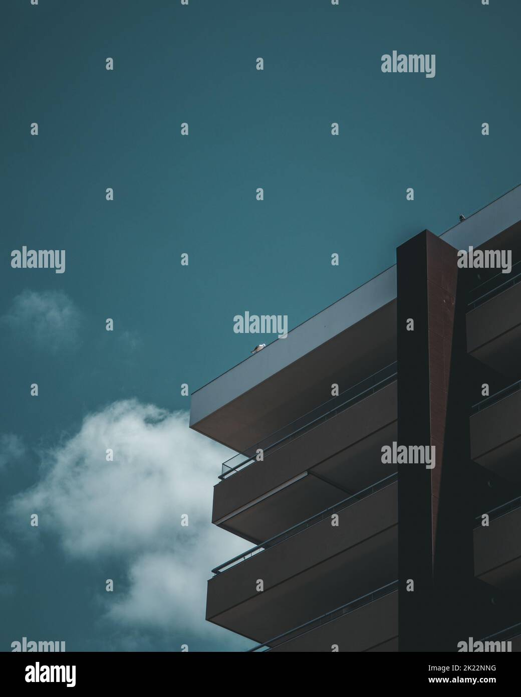 A low angle shot of corner balconies of modern apartment building on ...