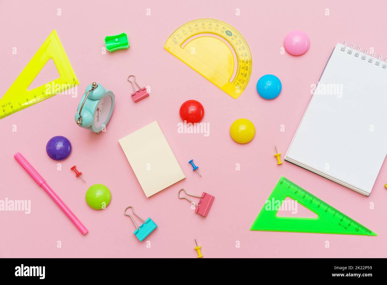 School supplies, stationery on pink background. Pens pencils notepad ...
