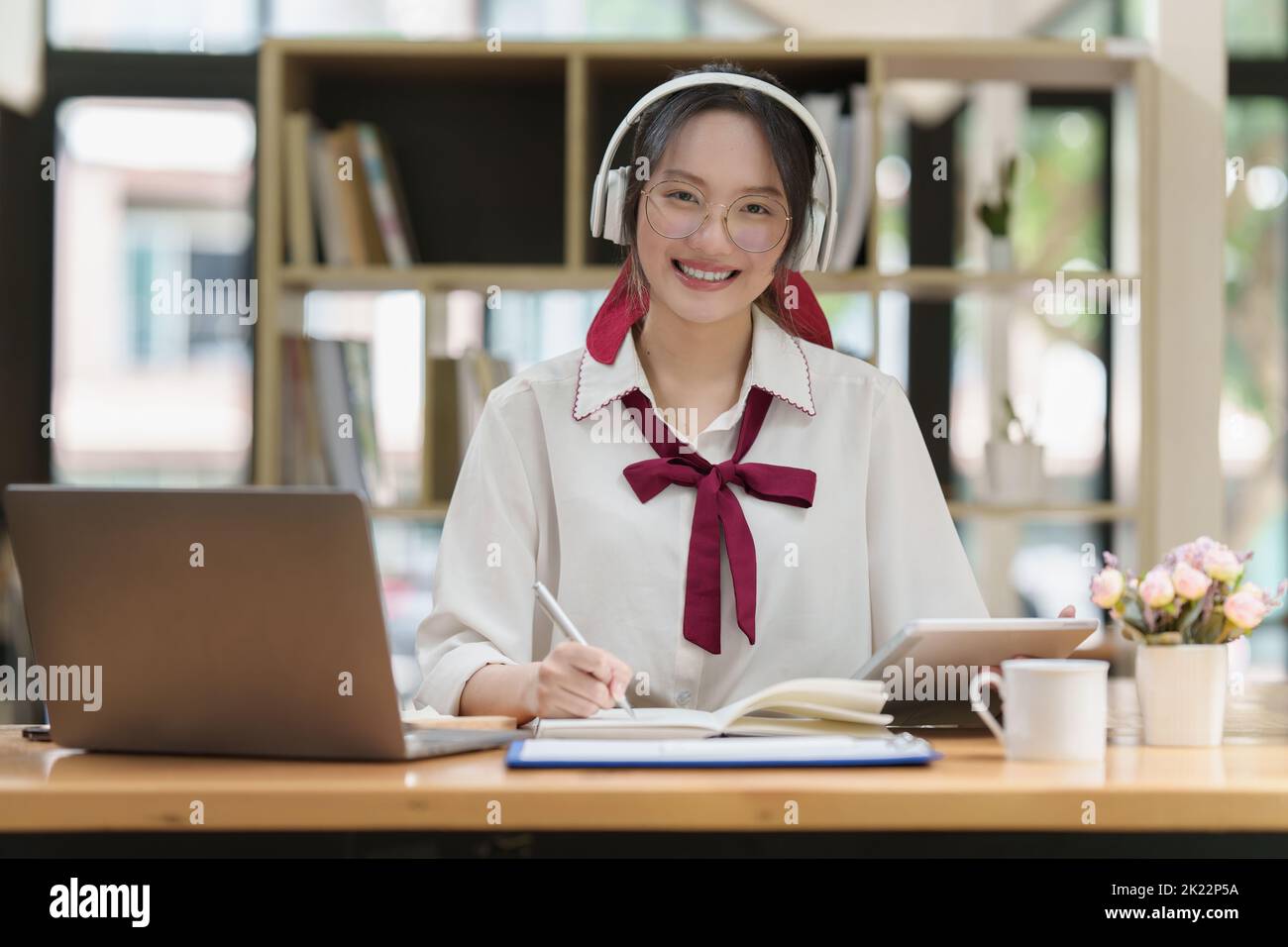 Young college student have question and answer to teacher by video call ...