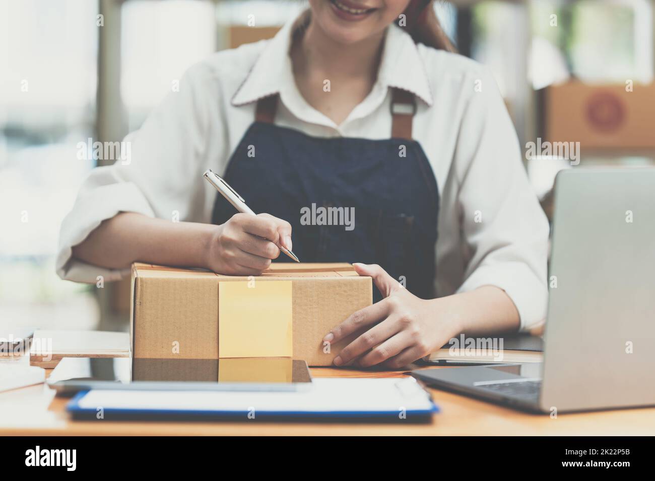 Asian small business owner working at home office. Business retail ...