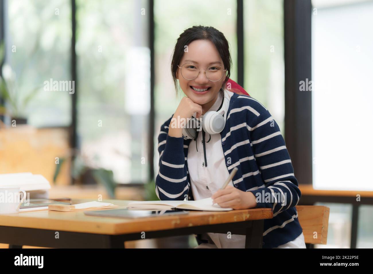 Young college student have question and answer to teacher by video call ...