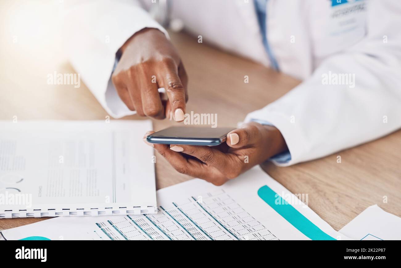 Phone, communication and doctor typing an email on a medical report ...