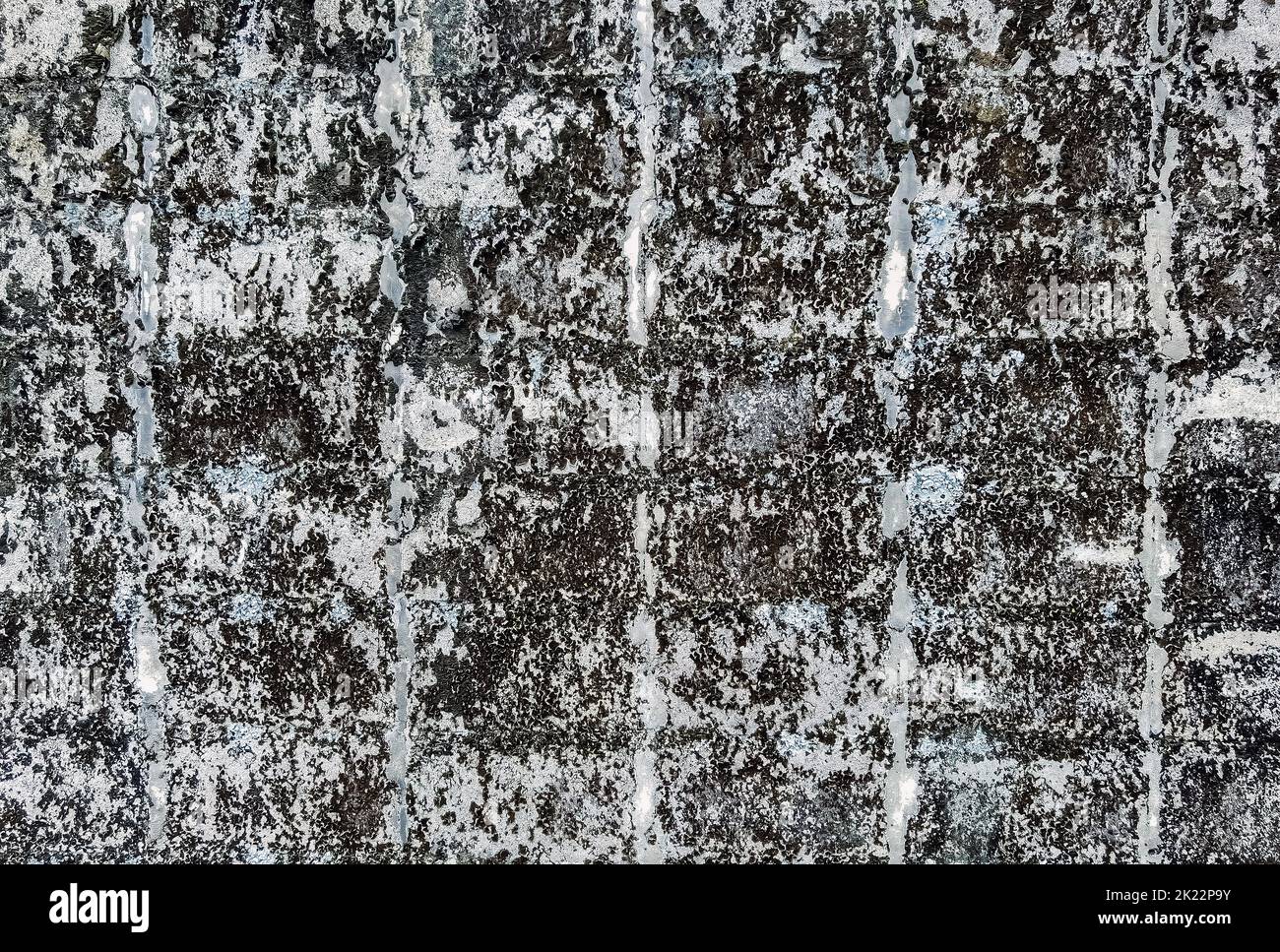 Dirty old eroded cracked plaster cement block fence. Concrete block ...