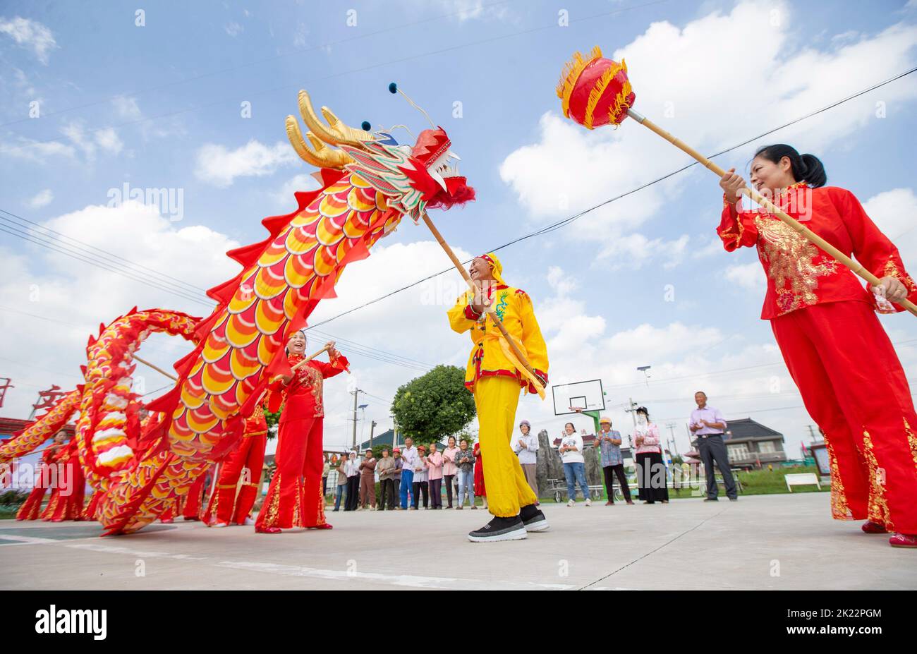 HAI'AN, CHINA - SEPTEMBER 22, 2022 - Villagers perform a dragon dance ...