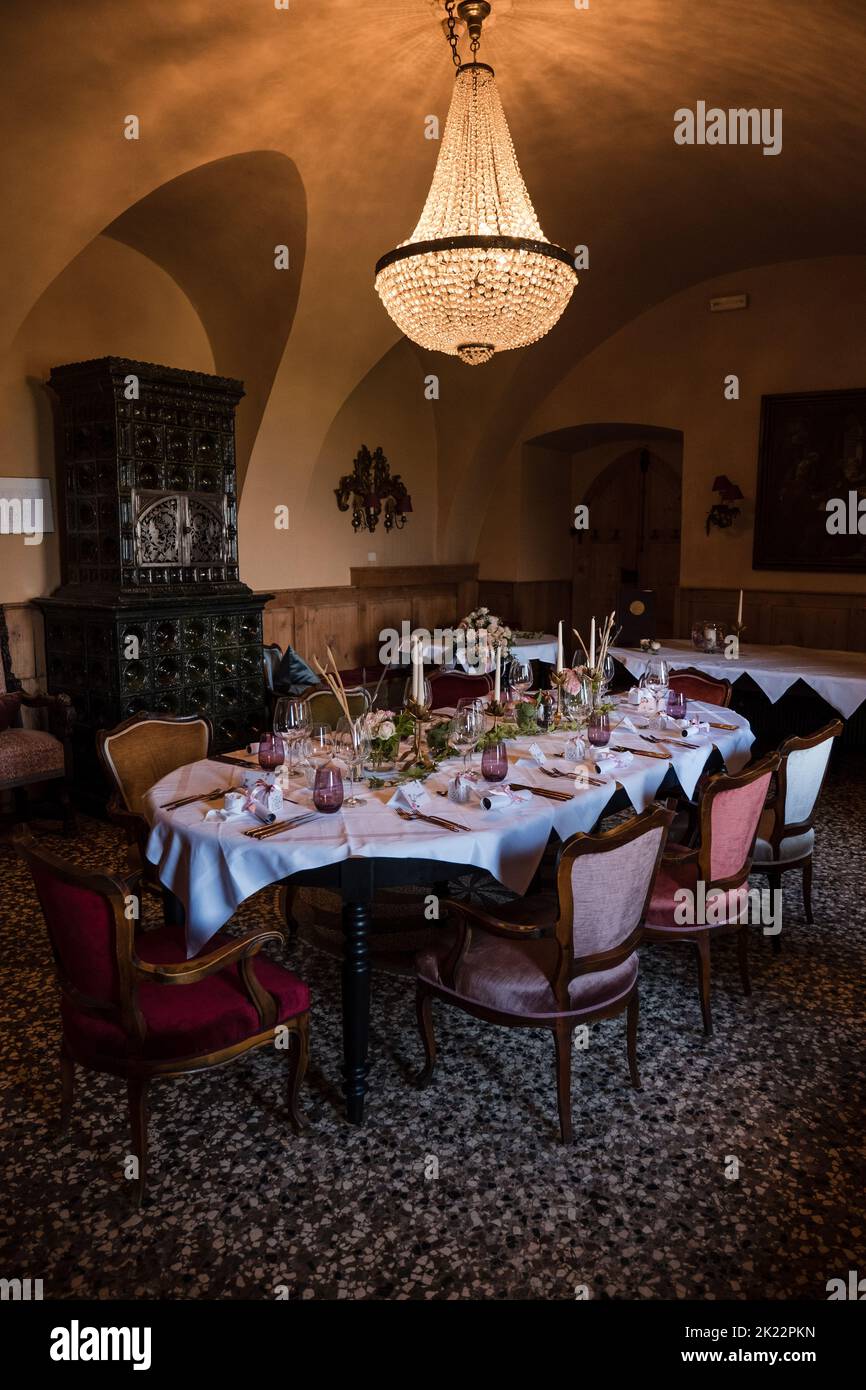 A vertical shot of a beautiful wedding venue with an organized table ...