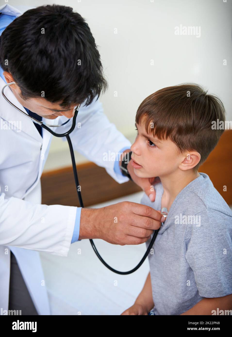 Cant wait to get home and play with my friends. a doctor gently ...