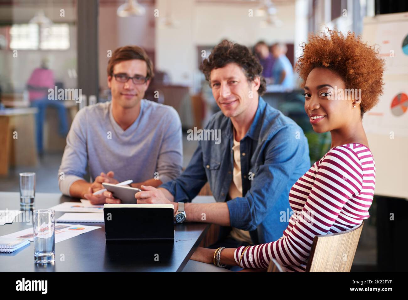 The project is looking great. a group of colleagues collaborating with ...