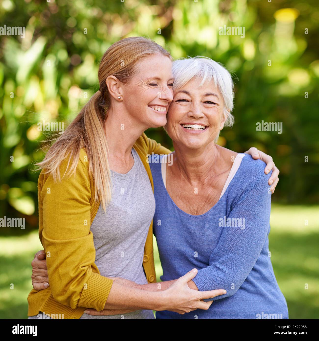 They share a strong bond. Portrait of an attractive young woman hugging ...