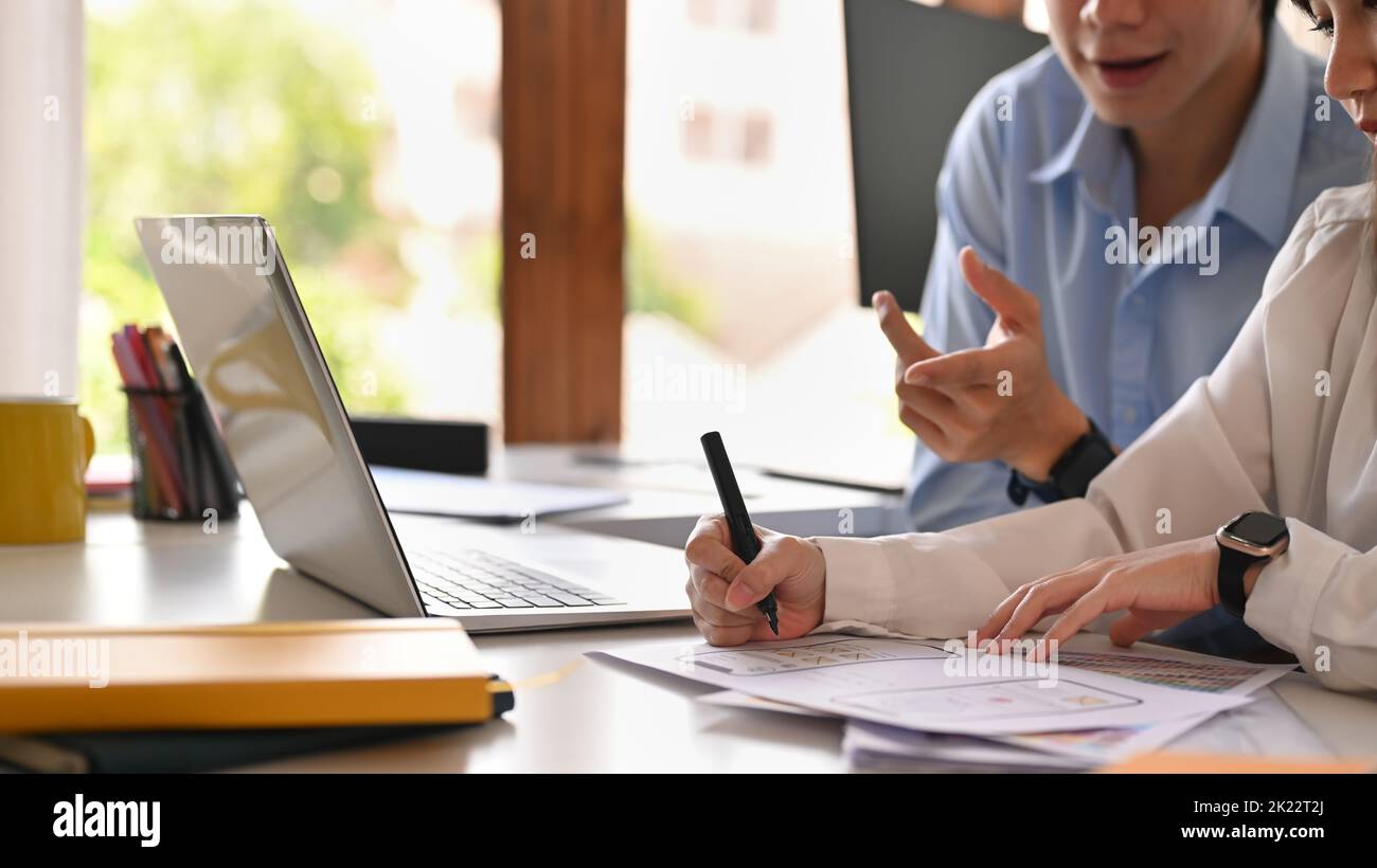 Cropped image of creative people planning, working together on mobile ...