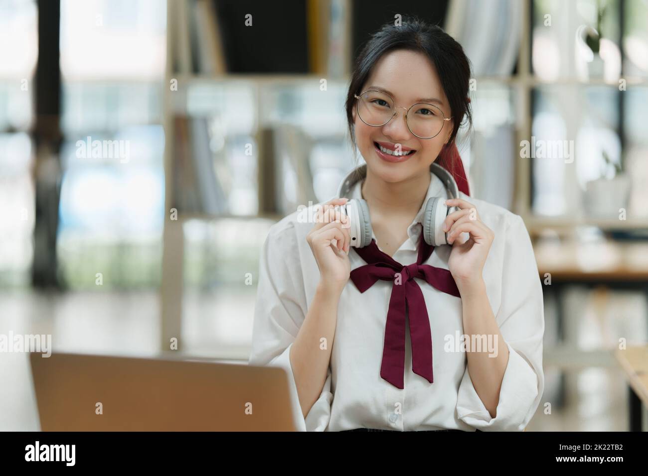 Young college student have question and answer to teacher by video call ...