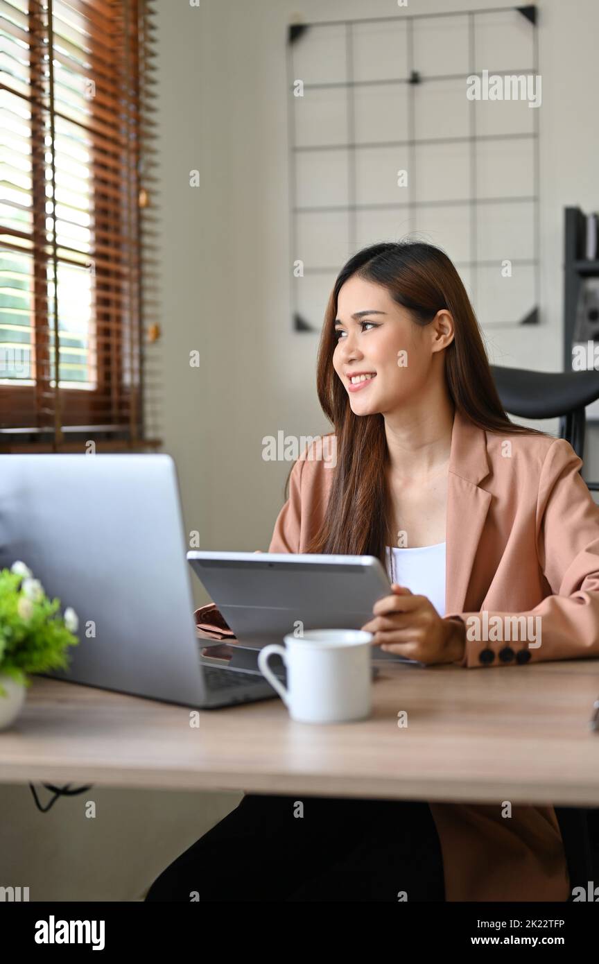 Portrait, Happy and successful millennial Asian businesswoman or female ...