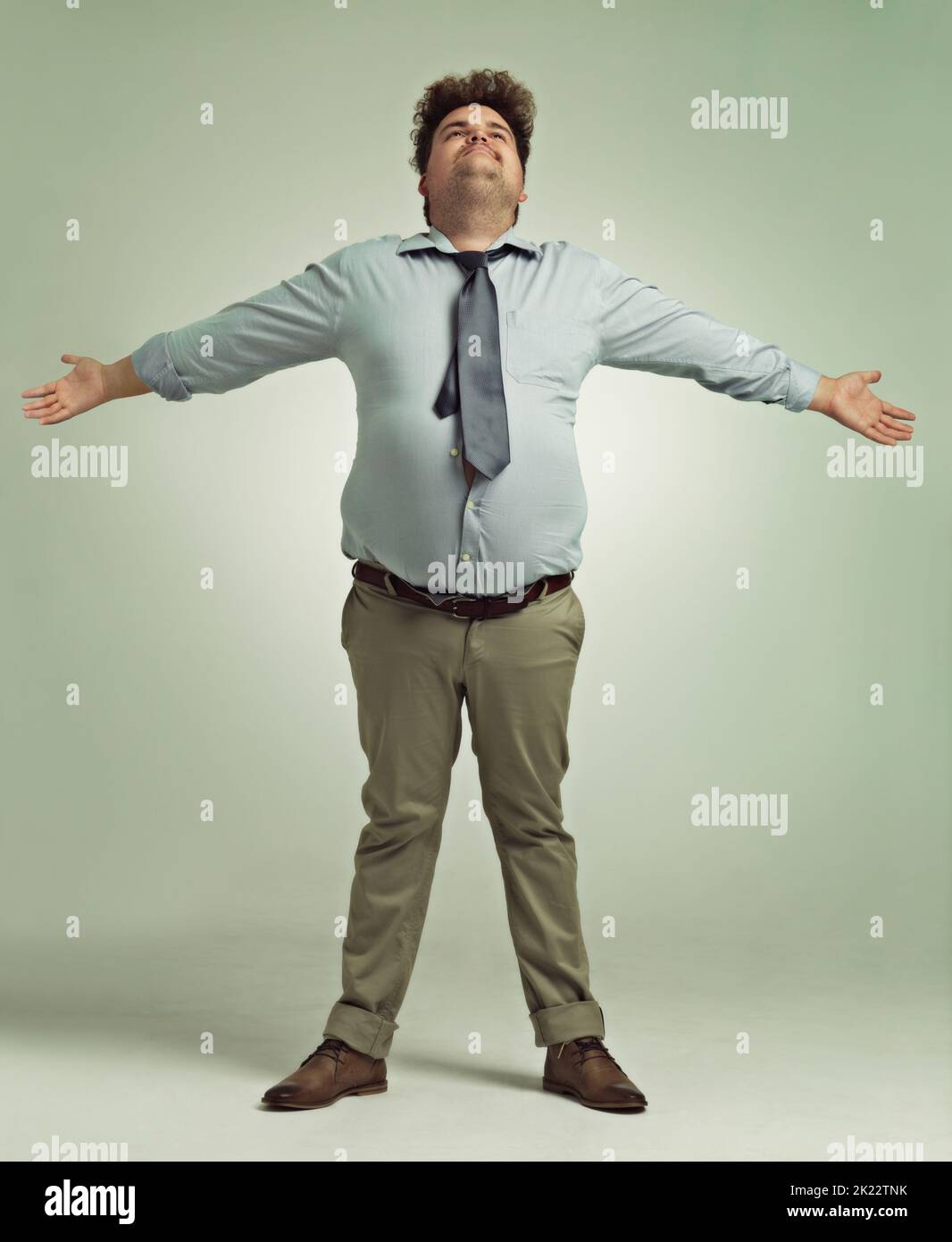 Hug me. Full length shot of an overweight man with his arms ...