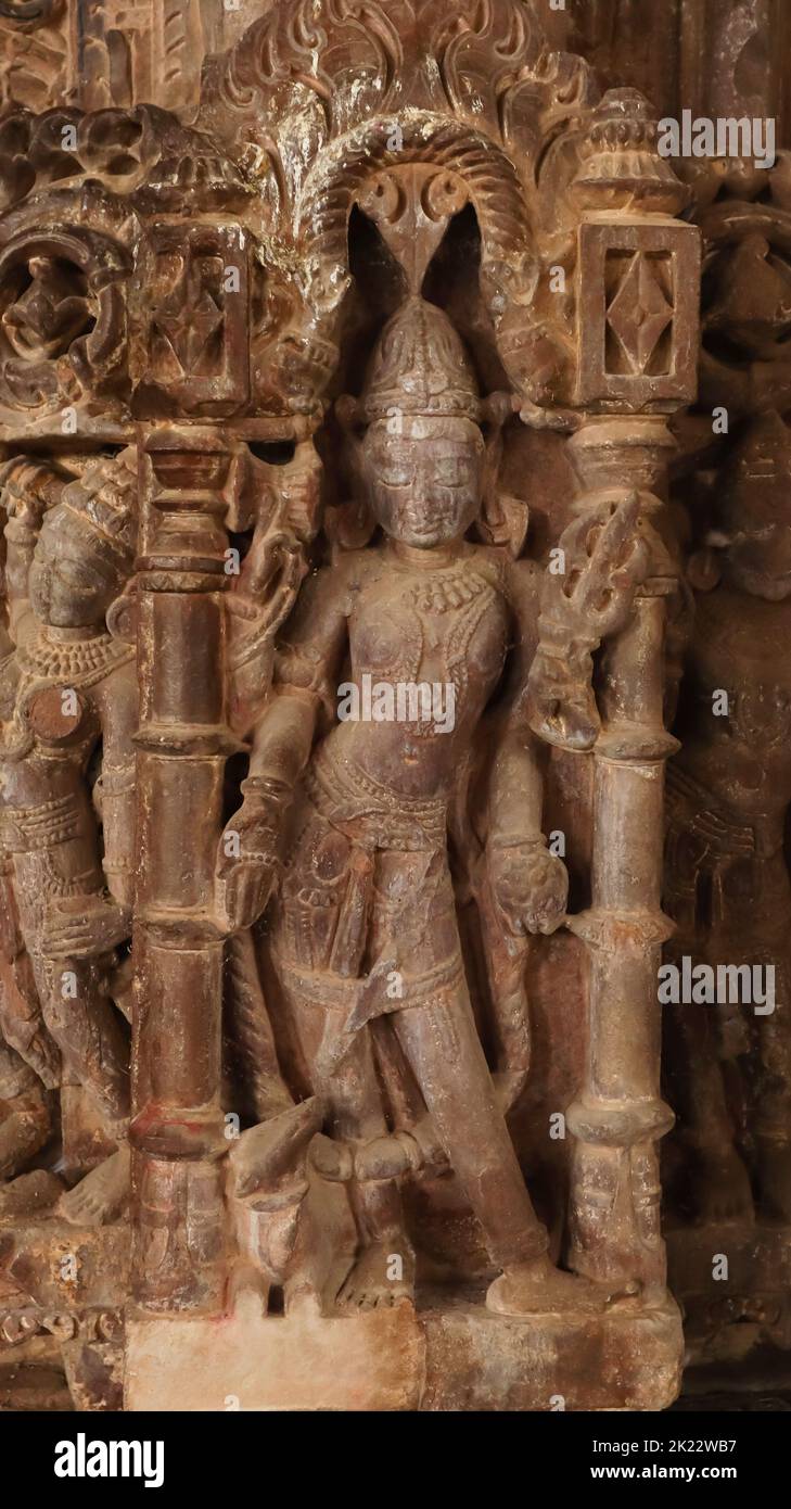 Sculpture of doorkeeper or guardian at shrine entrance. Undeshwar ...