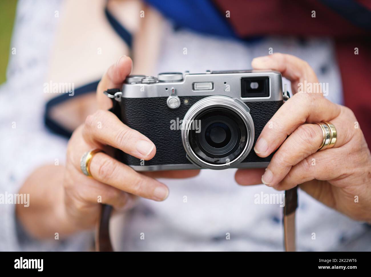 Retro camera, photography and travel with hands of a senior woman ...