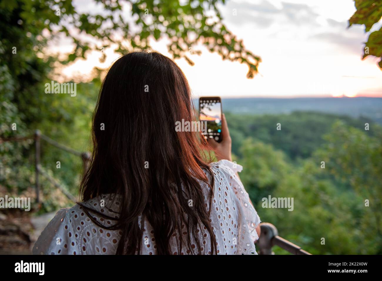 Woman camera looking through photos hi-res stock photography and images ...