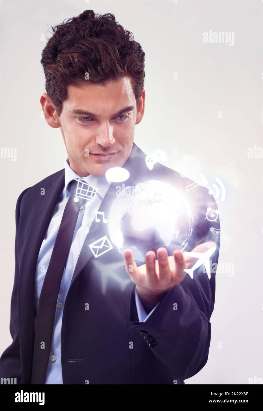 Hes got the future in his hands. A handsome young businessman holding a ...