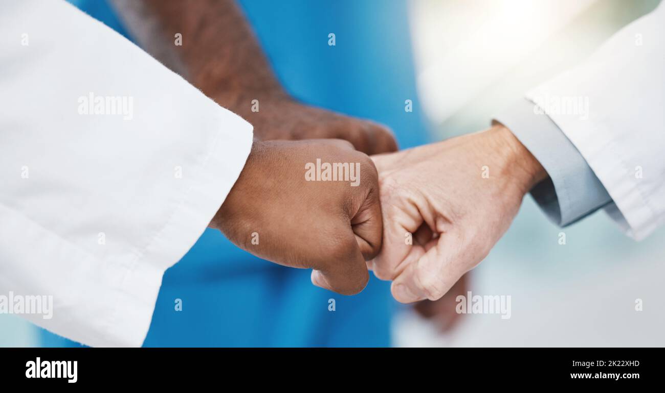 Fist bump hands, healthcare teamwork and group support for medical goals, collaboration and ...