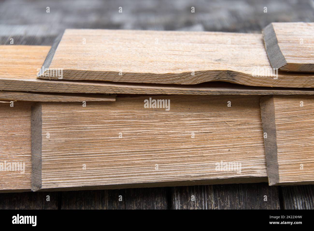 Close up of new overlapping wood wooden shingles as a concept for old ...