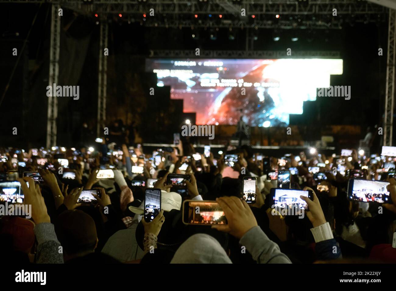 Many people with phone on stage Stock Photo - Alamy