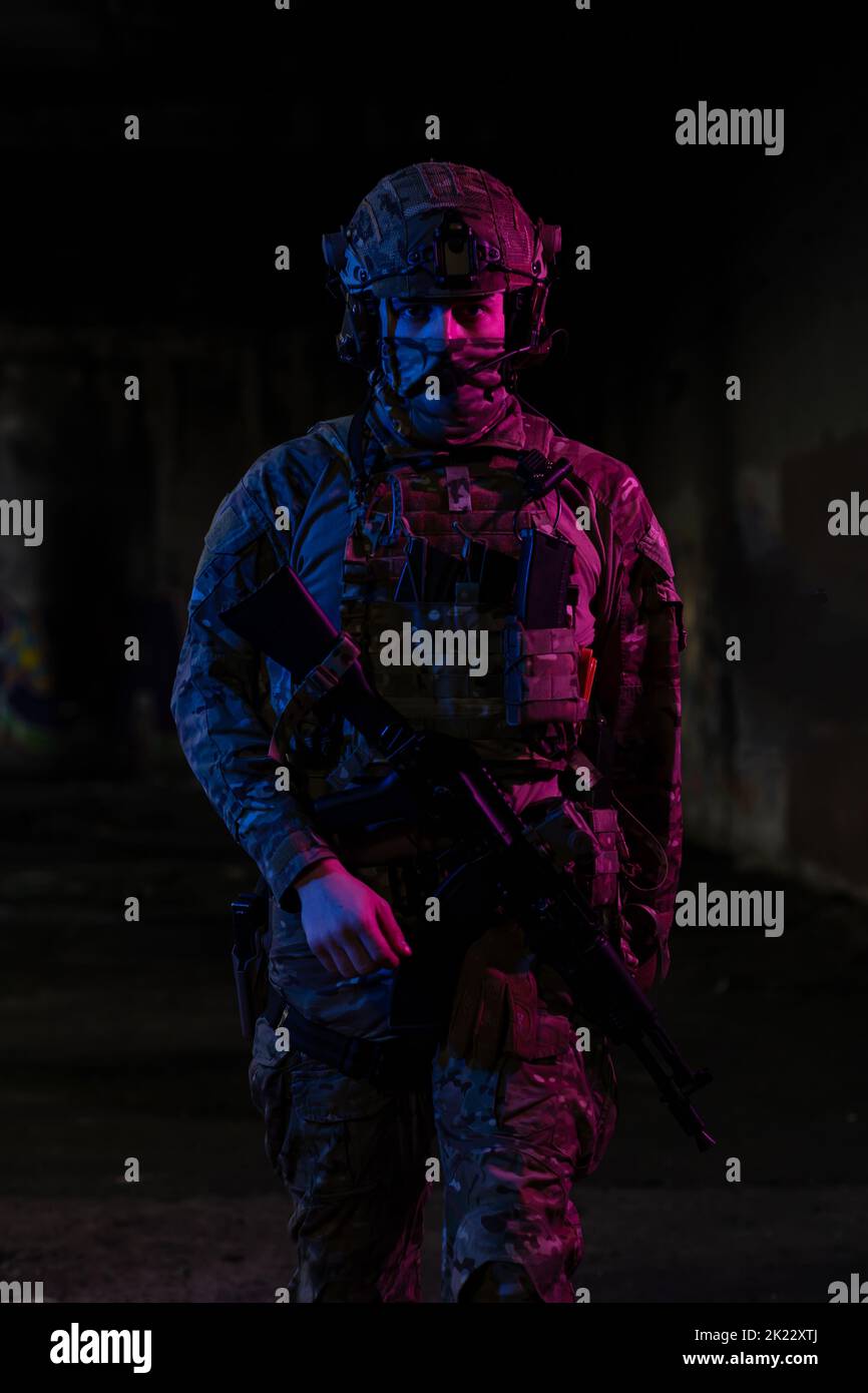 Army soldier in Combat Uniforms with an assault rifle and combat helmet ...