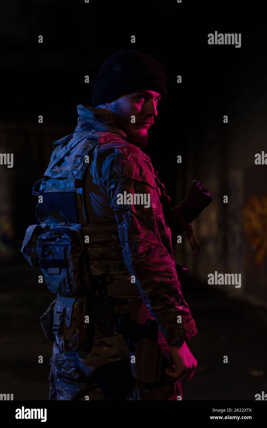 Army soldier in Combat Uniforms with an assault rifle and combat helmet ...