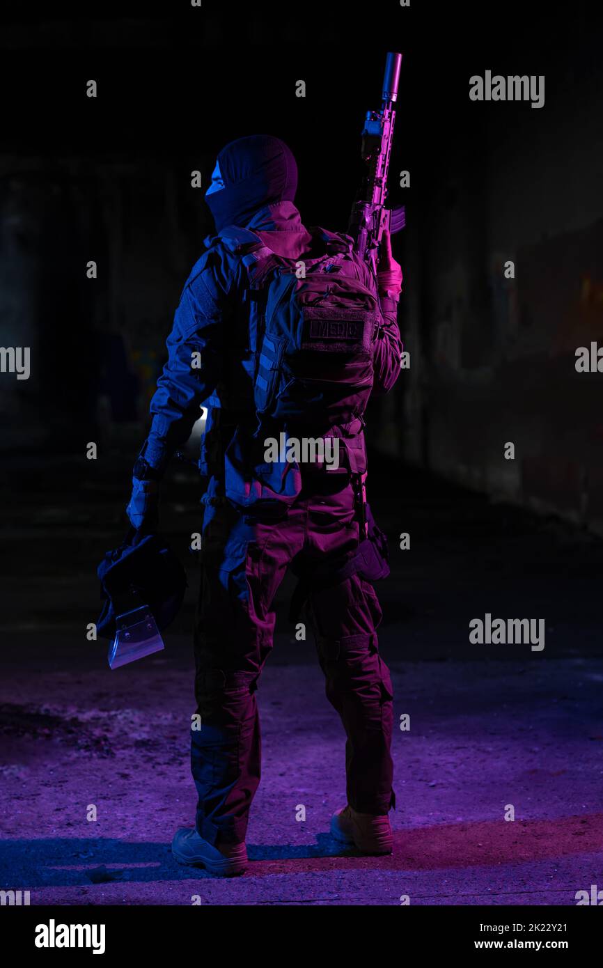 Army soldier in Combat Uniforms with an assault rifle and combat helmet ...