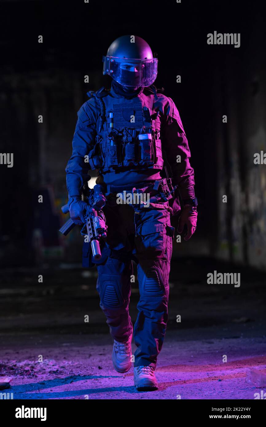 Army soldier in Combat Uniforms with an assault rifle and combat helmet ...