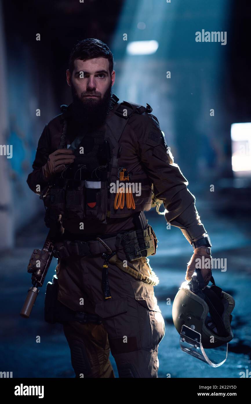 Army soldier in Combat Uniforms with an assault rifle and combat helmet ...