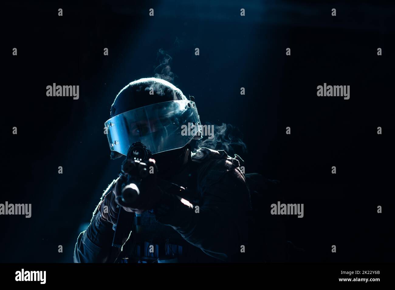 Army soldier in Combat Uniforms with an assault rifle and combat helmet ...