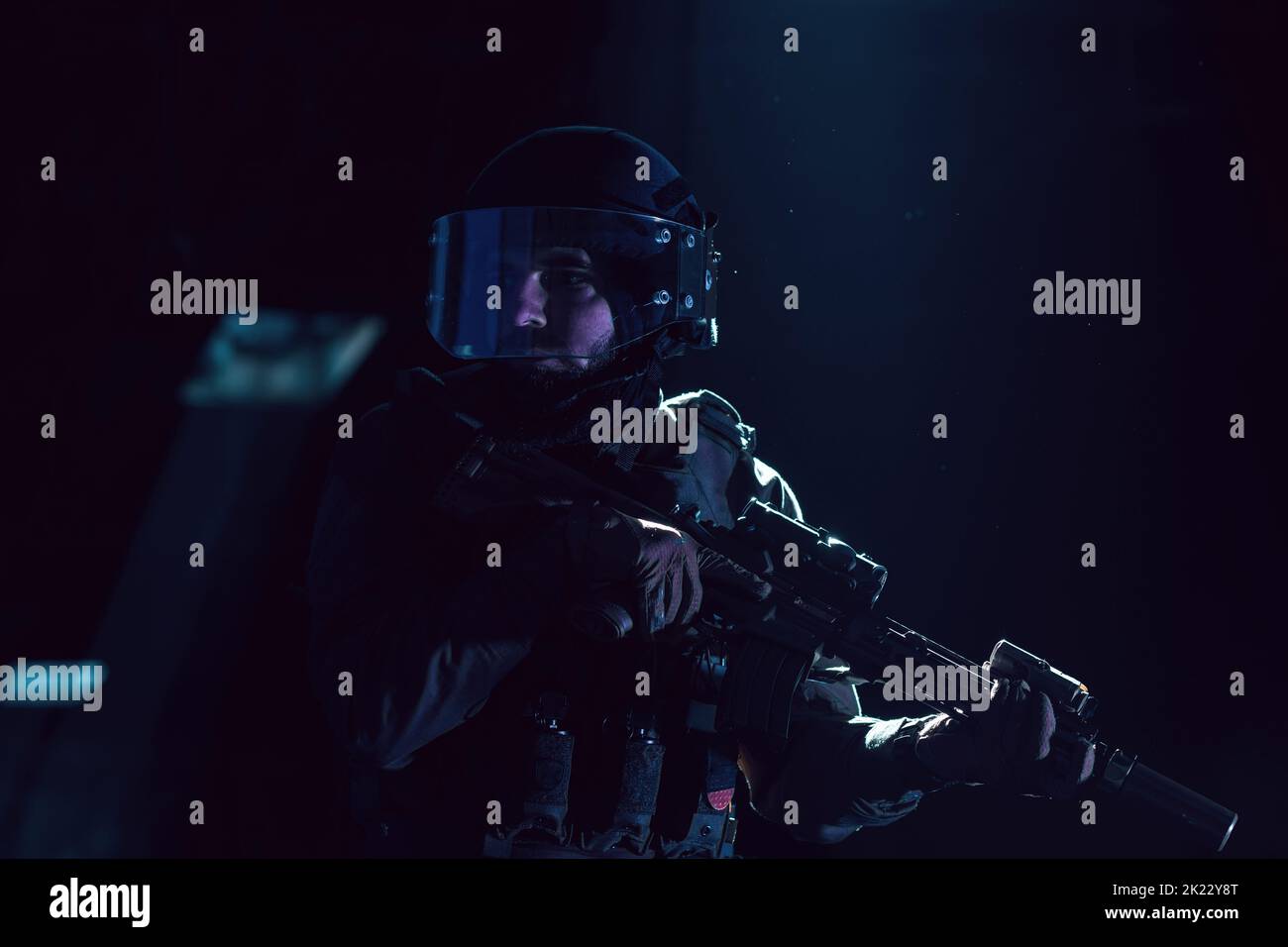 Army soldier in Combat Uniforms with an assault rifle and combat helmet ...