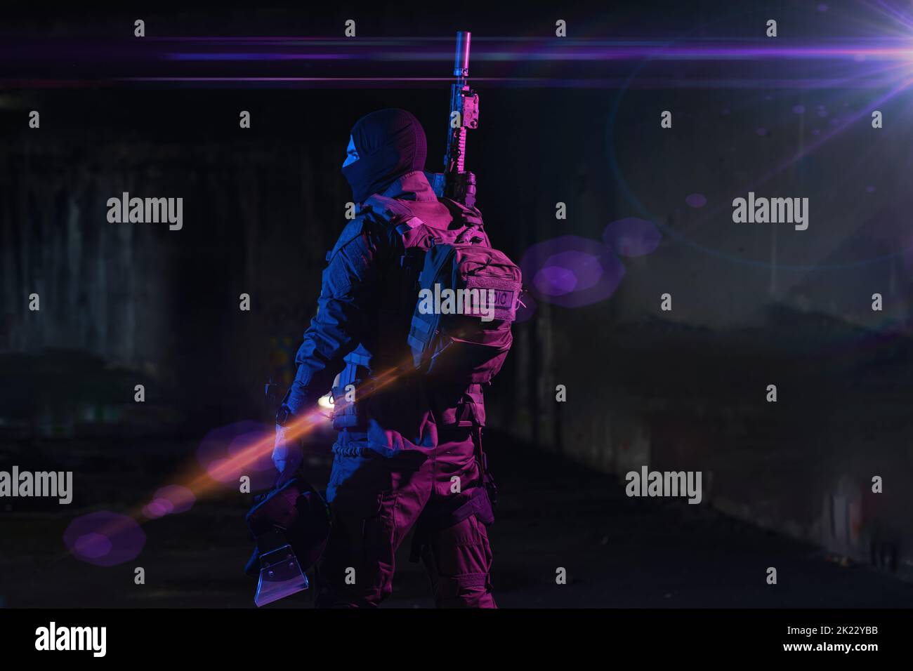 Army soldier in Combat Uniforms with an assault rifle and combat helmet ...