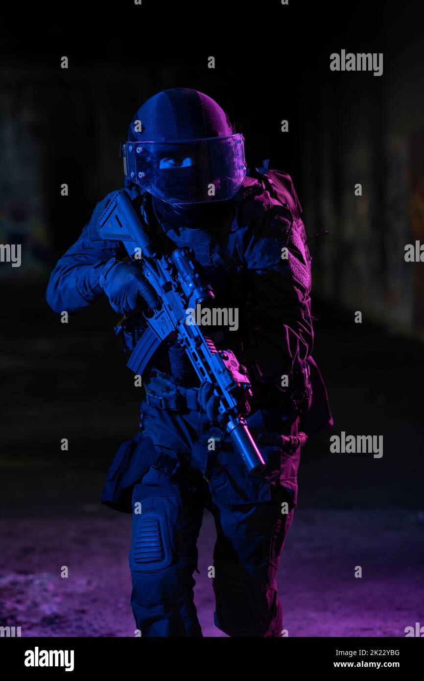 Army soldier in Combat Uniforms with an assault rifle and combat helmet ...