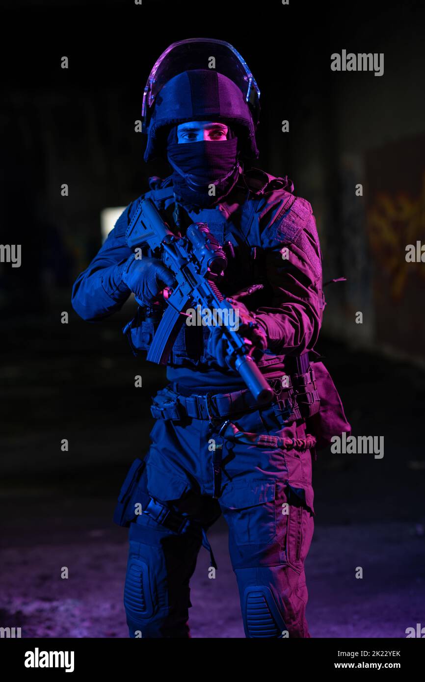 Army soldier in Combat Uniforms with an assault rifle and combat helmet ...