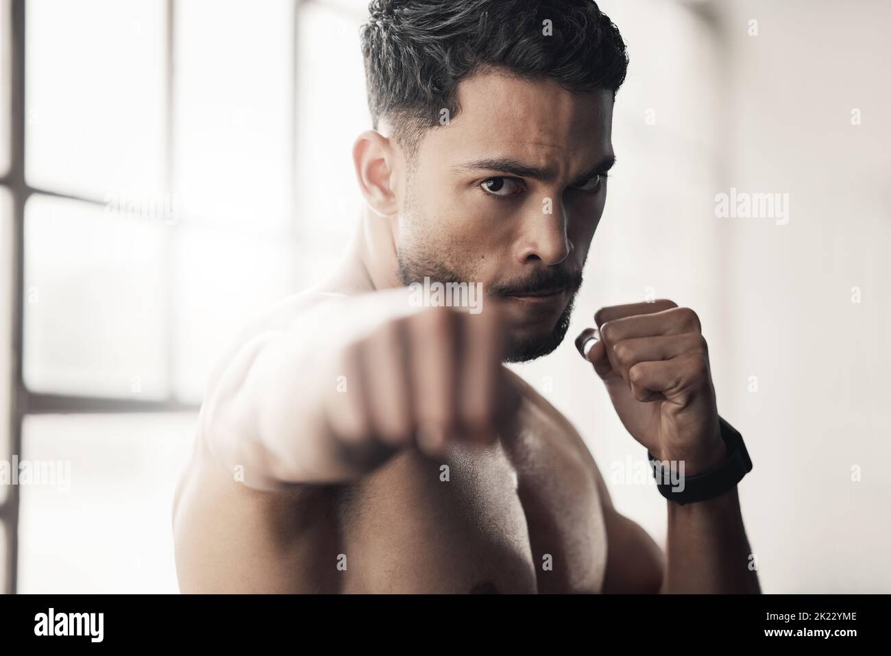 Energy, power and boxing by man fist punch in a gym or fitness studio ...