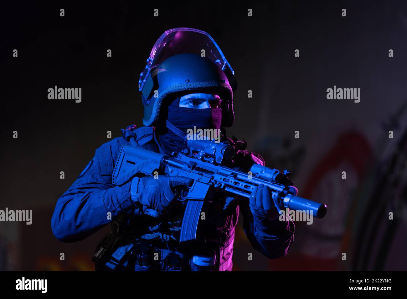 Army soldier in Combat Uniforms with an assault rifle and combat helmet ...