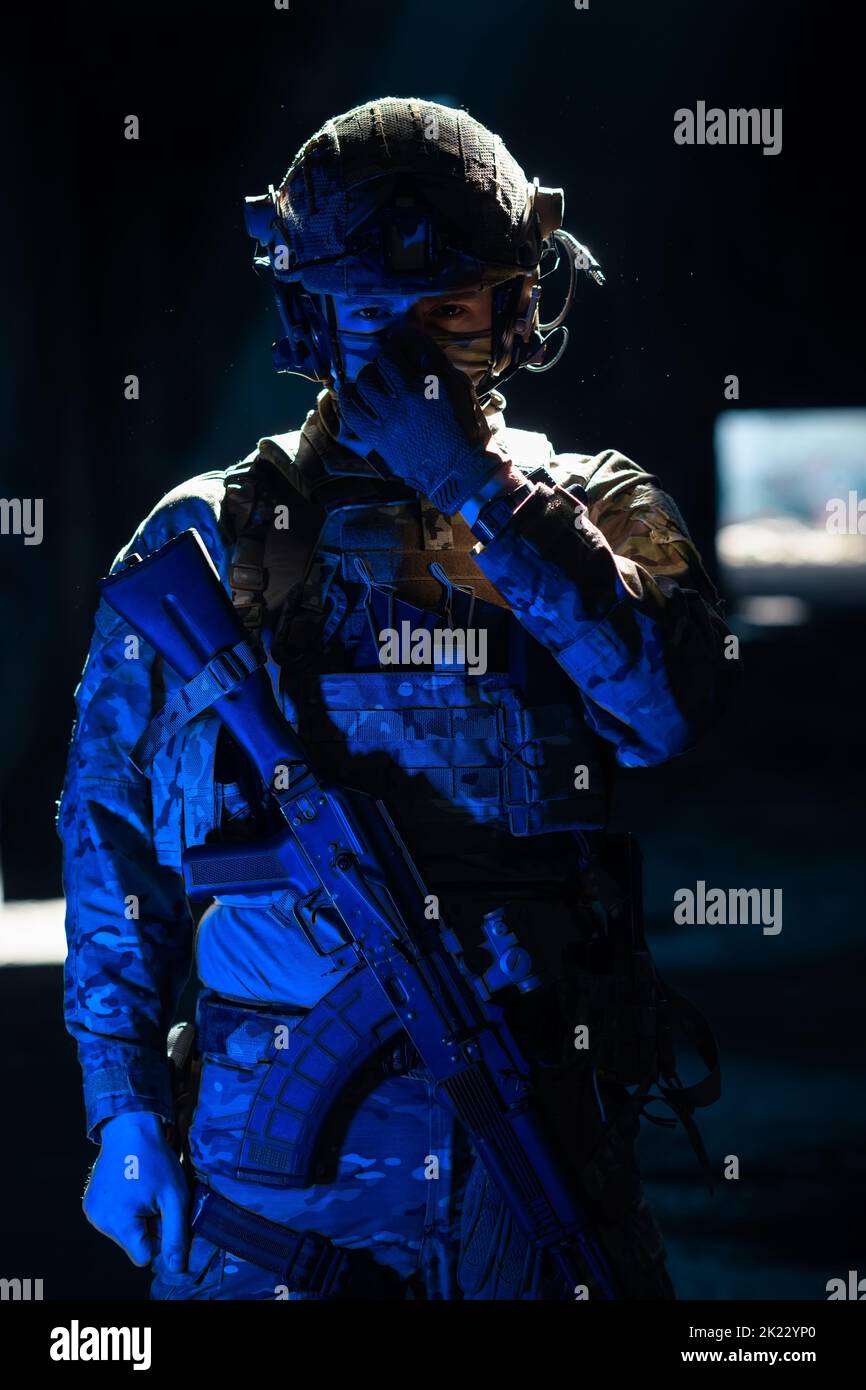 Army soldier in Combat Uniforms with an assault rifle and combat helmet ...