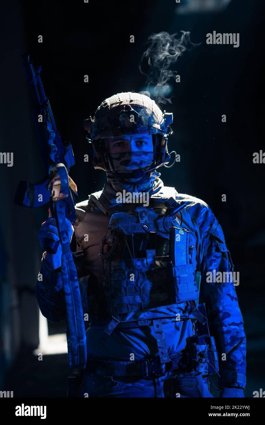Army soldier in Combat Uniforms with an assault rifle and combat helmet ...