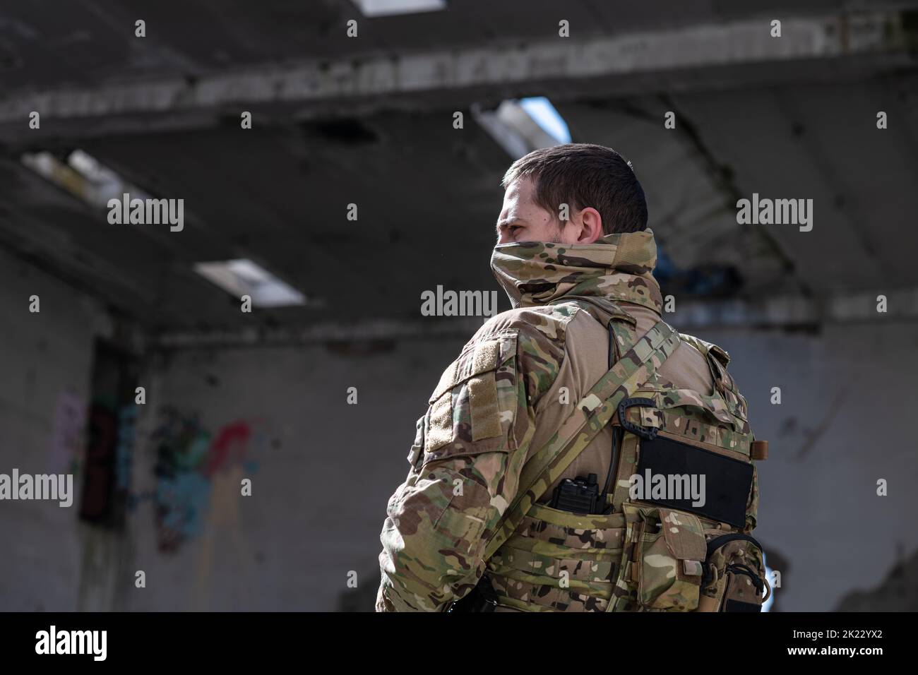 Army soldier in Combat Uniforms with an assault rifle and face ...