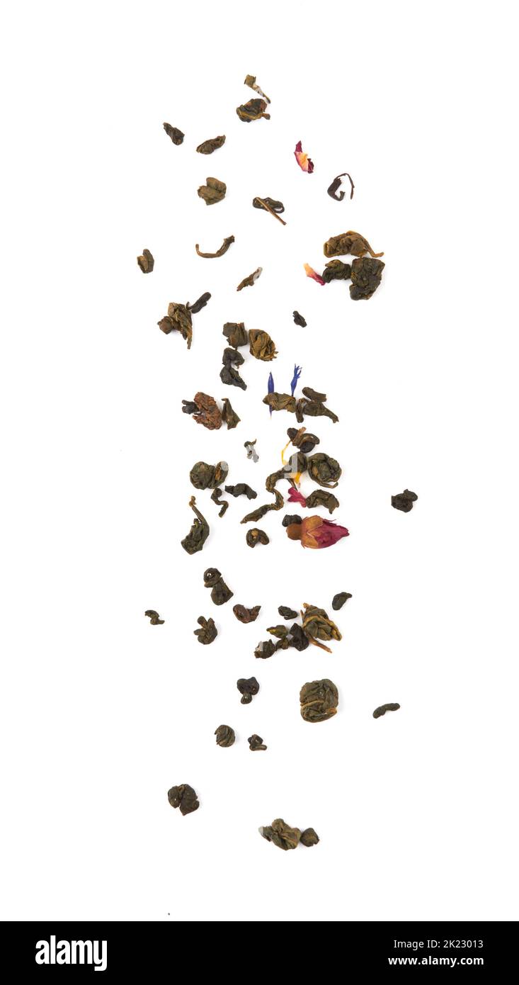 Falling dried tea leaves isolated on white background Stock Photo - Alamy